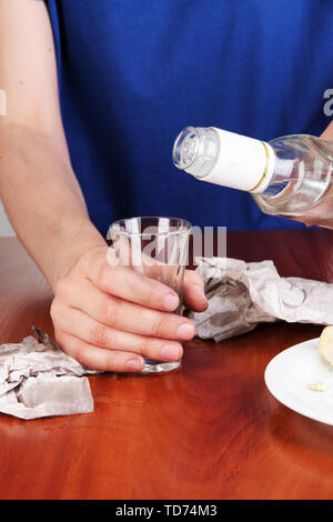 Drunk man drinks vodka at table close-up Stock Photo - Alamy