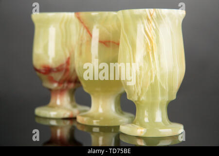 Onyx cups on grey background Stock Photo - Alamy
