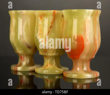 Onyx cups on grey background Stock Photo - Alamy