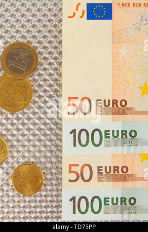 Euro banknotes and euro cents on grey glass background Stock Photo - Alamy