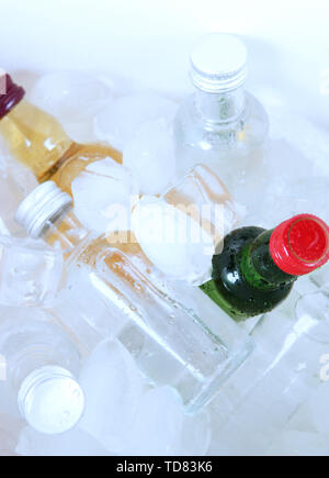 Minibar bottles with ice cubes, close-up Stock Photo - Alamy