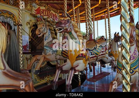 Fairground carousel ride Gallopers Steam driven Pebble beach Shops ...