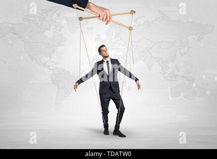 Puppet man with big city great power concept Stock Photo - Alamy