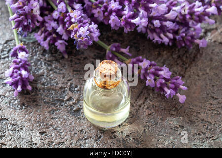 A bottle of essential oil with fresh blooming yarrow twigs Stock Photo ...