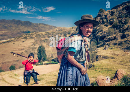 Peruvian Boy In Traditional Dress Playing A Wooden Flute Stock Photo ...