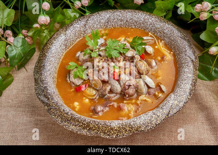 Fat cow clam golden needle mushroom chowder Stock Photo - Alamy
