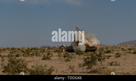 An M1150 Assault Breacher Vehicle that launches a mine clearing line ...