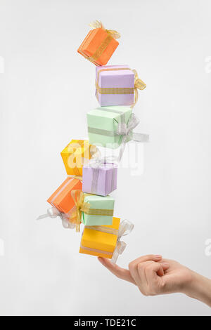 Floating red gift boxes with ribbons on a light blue background Stock ...