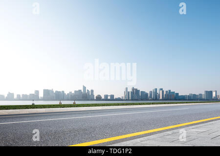 empty asphalt road with cityscape of modern city Stock Photo - Alamy