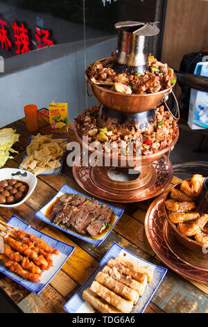 Charcoal fire frog pot field chicken meal Stock Photo - Alamy