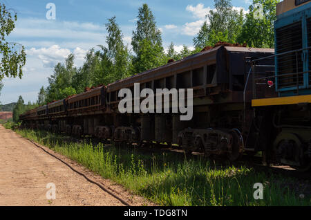 The train loaded with clay leaving opencast mining site Stock Photo - Alamy