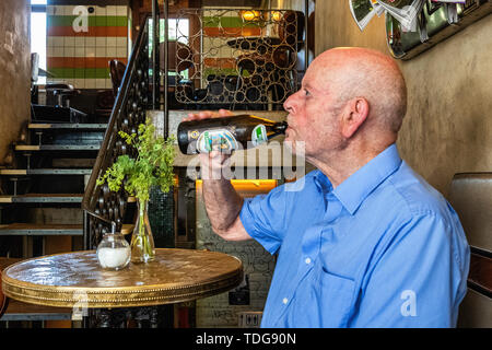 Berlin Prenzlauer Berg. Haliflor Bar & cafe interior. Elderly man ...