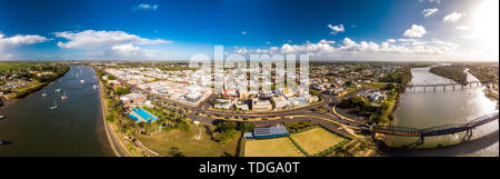 Aerial view of Bundaberg city and the Burnett River, with farmland ...