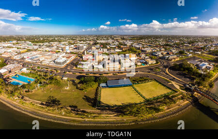 Aerial view of Bundaberg city and the Burnett River, with farmland ...