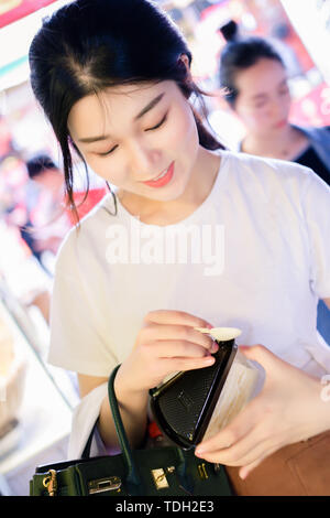 Street filming little sister, lock screen magazine Stock Photo - Alamy