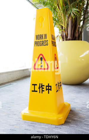 Yellow cone,work in progress signs Stock Photo - Alamy