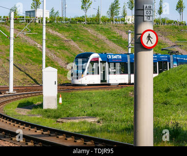 Tram arriving at Edinburgh Gateway Tram / Train Station interchange on ...