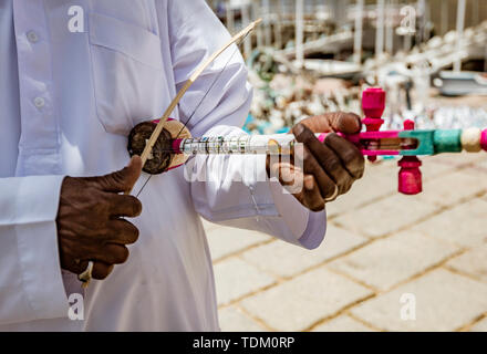 Jordanian Vendor Demonstrates How to Play Native Three String ...