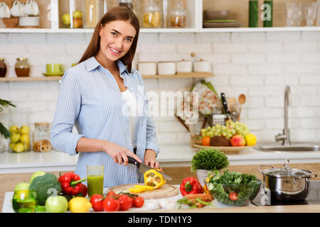 Cooking Vegetable Salad. Happy Woman Cutting Pepper Stock Photo - Alamy