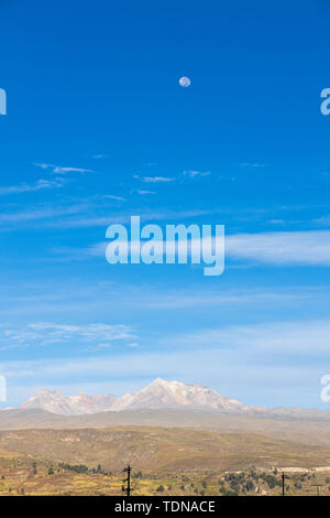 Full moon over the snowcapped Andes in Yanque, Colca canyon, Peru ...