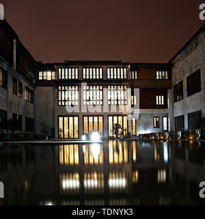 Night scene of traditional building near the river Stock Photo - Alamy