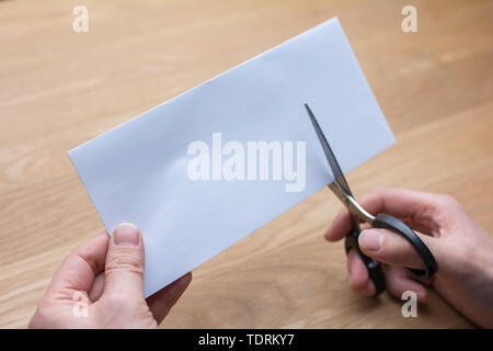 Topping cutting paper by scissors Stock Photo - Alamy