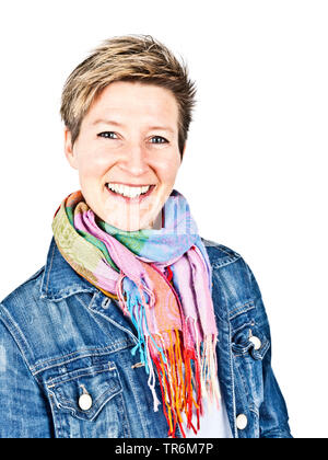 Vertical shot of beautiful elderly Caucasian woman sitting under a tree ...