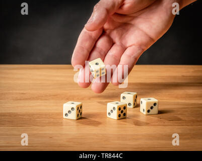 Throwing or rolling dice closeup isolated Stock Photo: 188156452 - Alamy