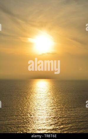 Beautiful sunset over the clam sea with cloud and sky background ...