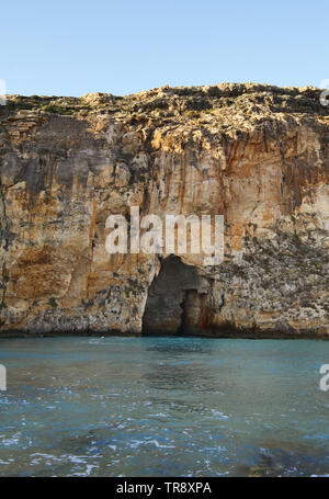 The view on Dwejra Inland sea and the Blue Hole grotto through the arch ...