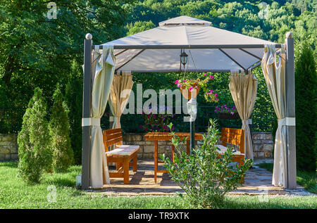 Wooden pergola at a beautiful green garden. Street photo, nobody ...