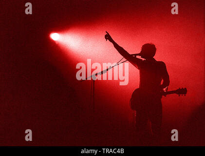 Amazing silhouette of a professional guitarist bandleader singer on ...