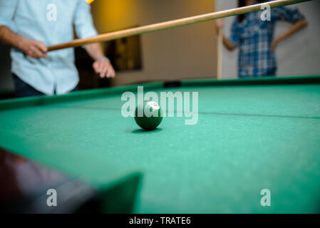 Young handsome man with beard plays billiards Stock Photo - Alamy