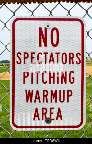 No spectator pitching warmup area sign on fence with baseball/ softball ...