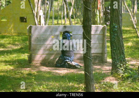 Paintball battle. The battlefield is equipped with barriers: they allow ...