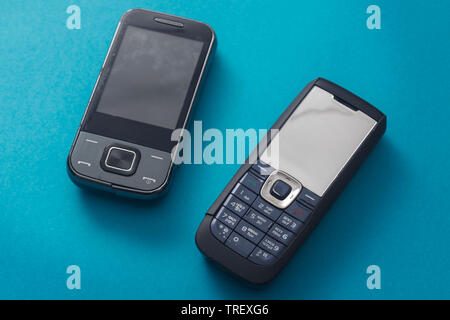 Old retro mobile phones on green background, from above Stock Photo - Alamy