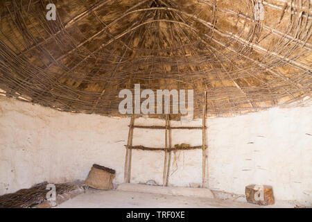 Thatched roof ceiling inside a recreated Neolithic stone age hut ...