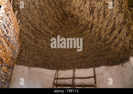 Thatched roof ceiling inside a recreated Neolithic stone age hut ...
