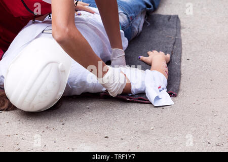 Workplace accident. First aid after occupational injury. Hand injury ...