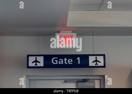 Emergency exit sign at airport, Terminal 5, Heathrow airport, London ...
