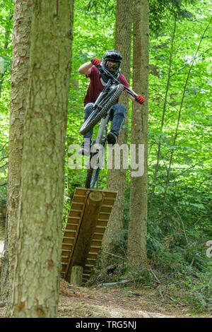 Jump session of professional young mountainbikers in a bike park in ...
