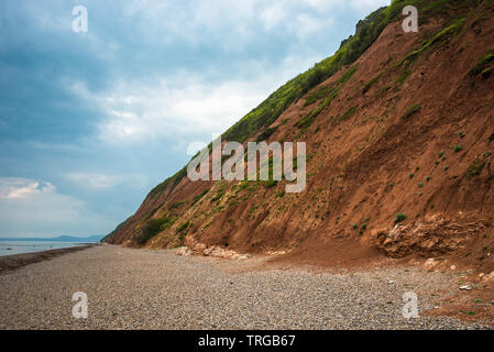 Golden brown cliffs and beach at Branscombe on the Jurassic coast in ...