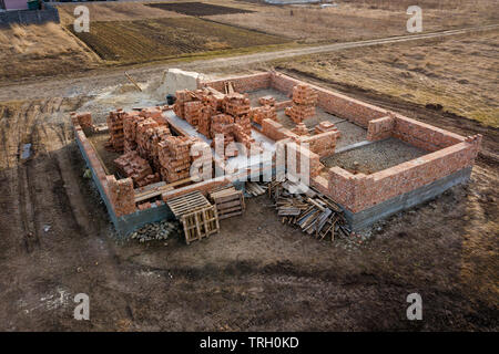 Building site of trenches dug in ground and filled with cement as ...
