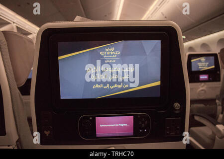 Etihad Airways seat screen and welcoming statement inside the air plane ...