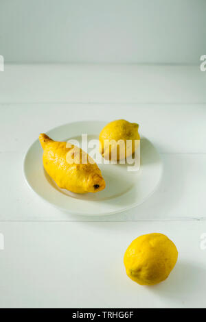 Trendy ugly organic three lemons unusual shape on white background ...