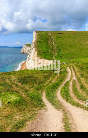 Coastline with bathing beach at Durdle Door, limestone rock bridge ...