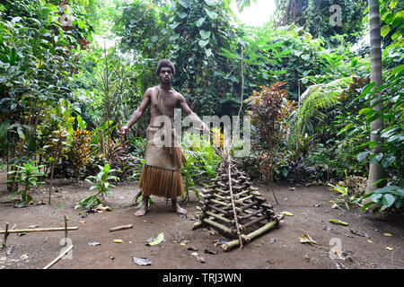 Young tribal man demonstrating how to use an animal trap, Pepeyo ...