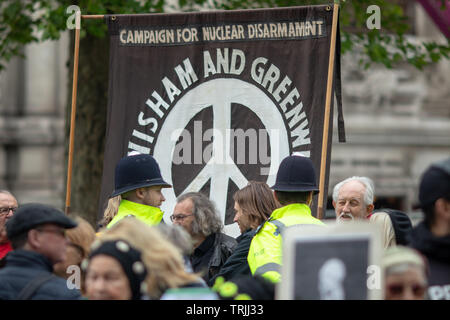 People holding signs at an anti nuclear energy rally in Boston ...