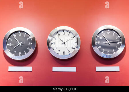 Wall of wall clocks, at the airport, showing time for 24 different time ...