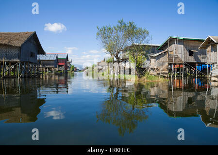 Myanmar, View of fishing village and wooden path at Lake Inle Stock ...
